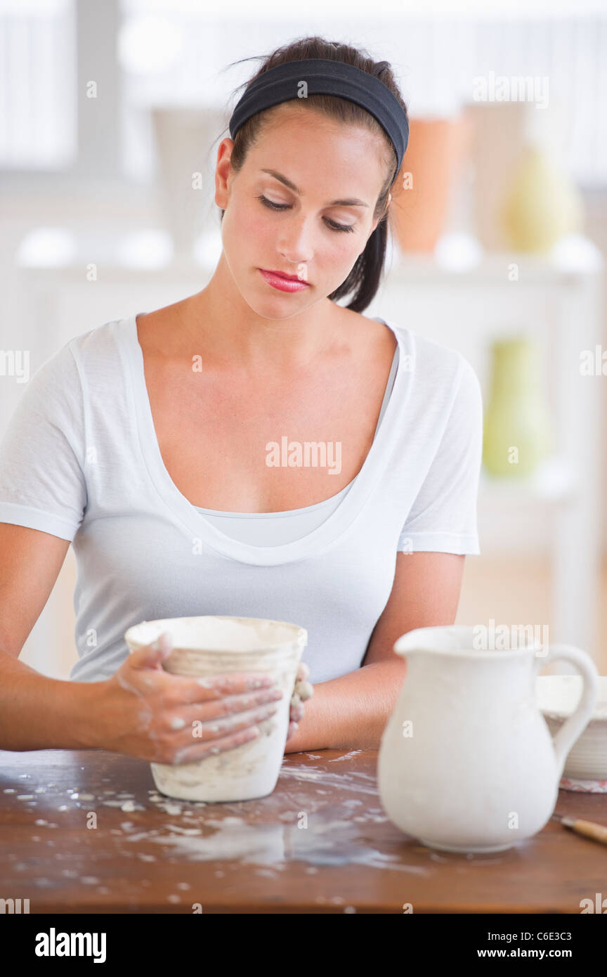 Woman making pottery Stock Photo - Alamy