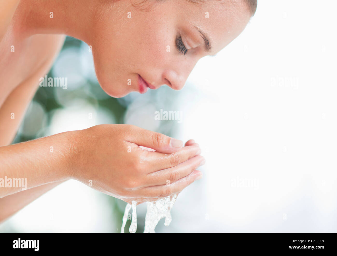 One woman washing face splash hi-res stock photography and images - Alamy
