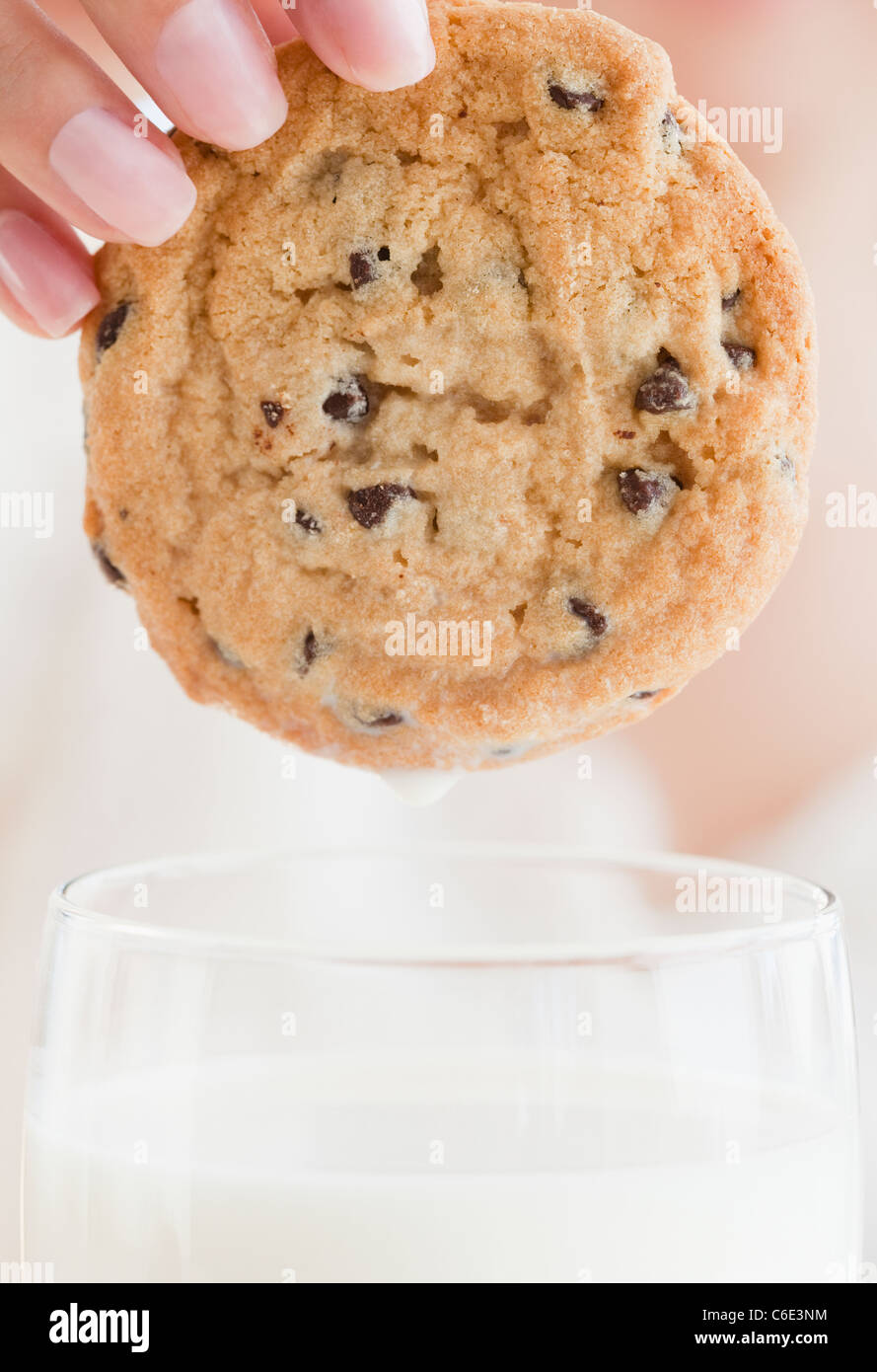 USA, New Jersey, Jersey City, Close up of woman's hand holding cookie ...