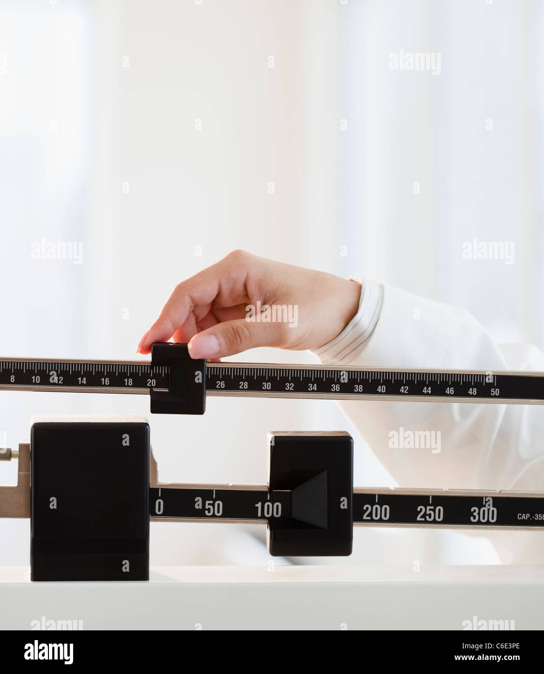 Doctor weight scale hi-res stock photography and images - Alamy