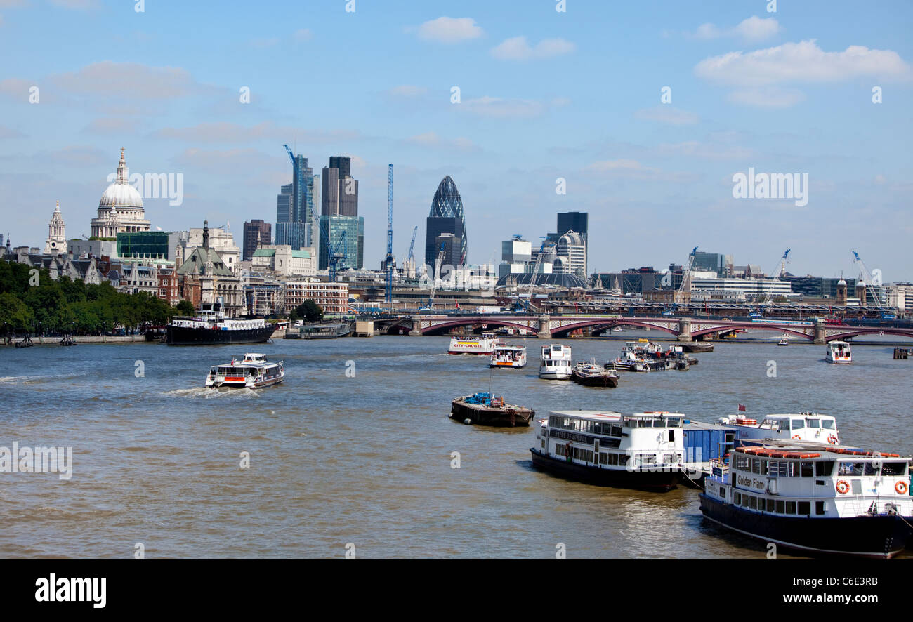Barges and ferry boats on the River Thames, London, England, UK Stock ...