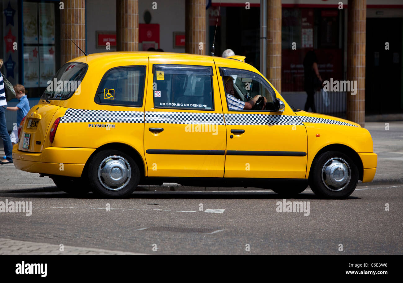 Yellow cab, Plymouth, Devon, England, UK Stock Photo - Alamy
