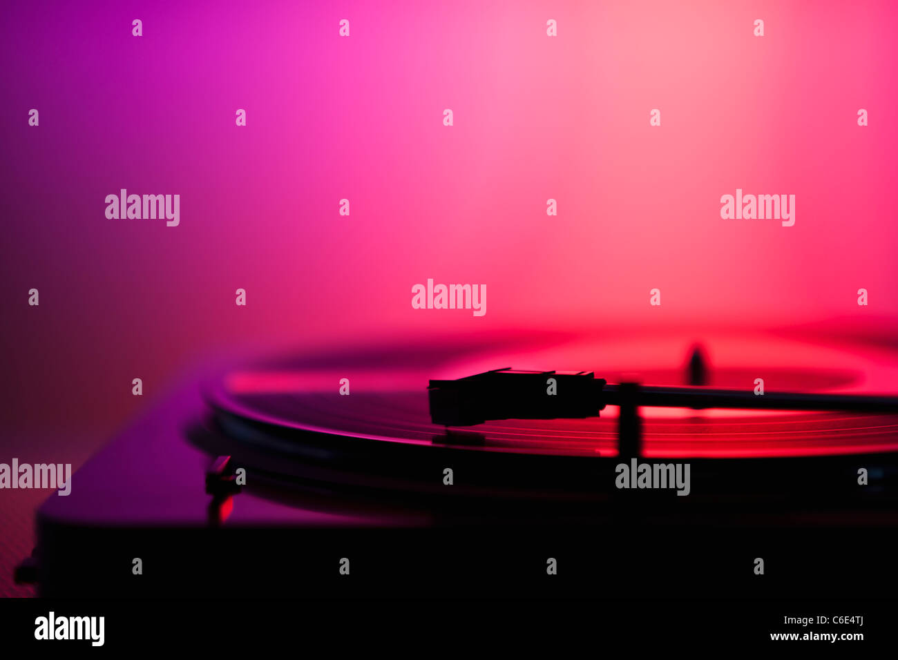 Close up of turntable on pink background Stock Photo - Alamy