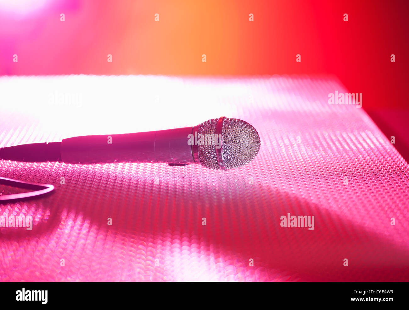 Close up of microphone lying on stage Stock Photo - Alamy