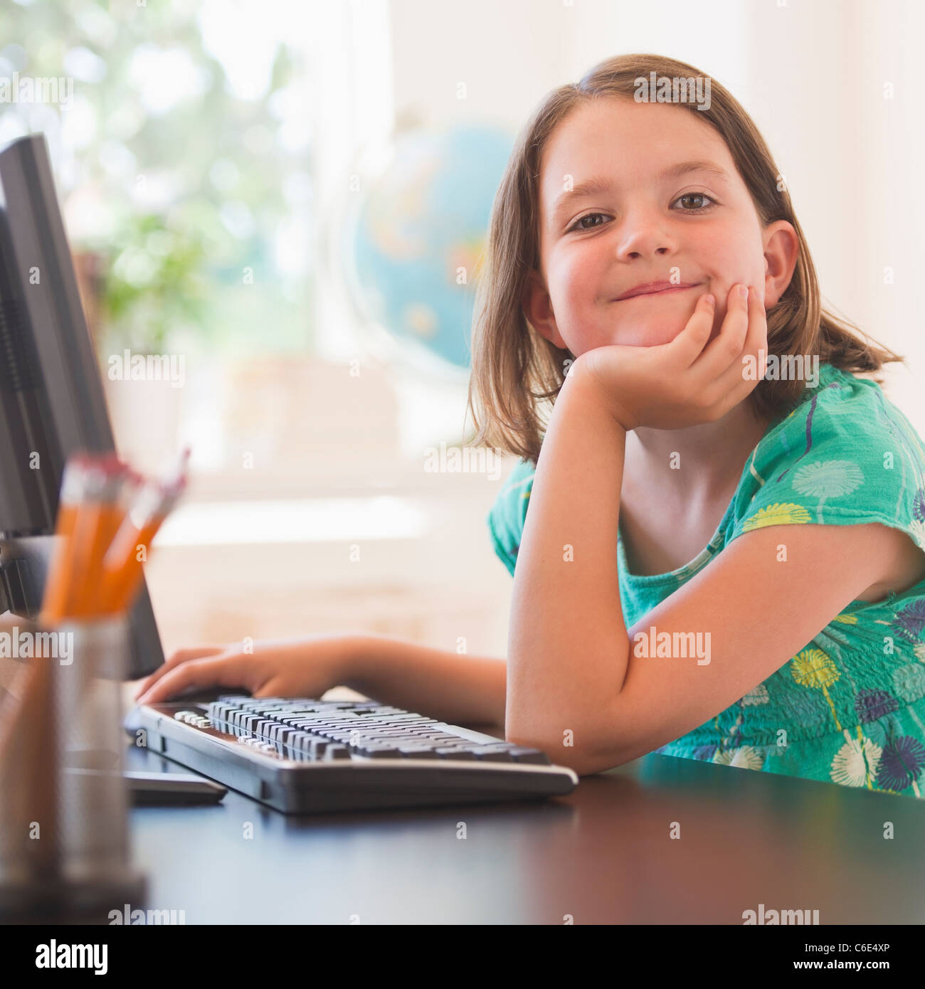 USA, New Jersey, Jersey City, Portrait of girl using computer in ...