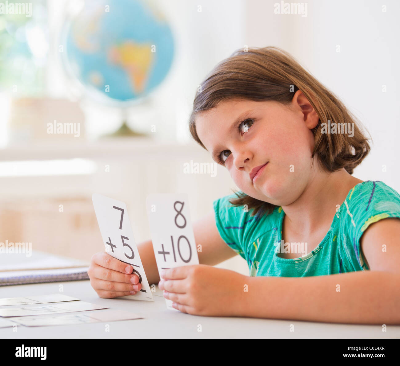 Girl sitting desk counting hi-res stock photography and images - Alamy