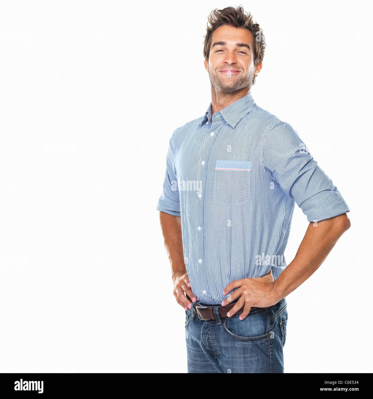 Studio shot of young pride man with hands on hips Stock Photo - Alamy