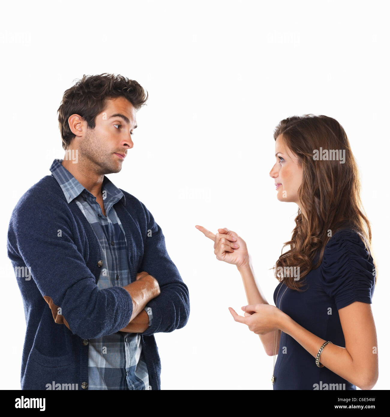 Studio shot of young couple having argument Stock Photo - Alamy