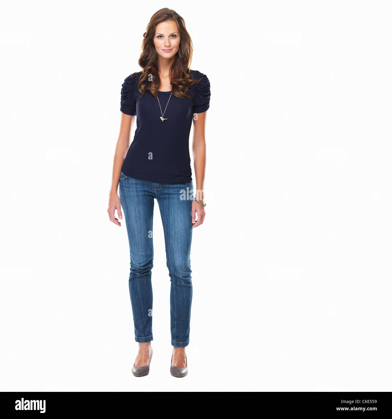 Studio shot of young beautiful woman standing on white background Stock ...