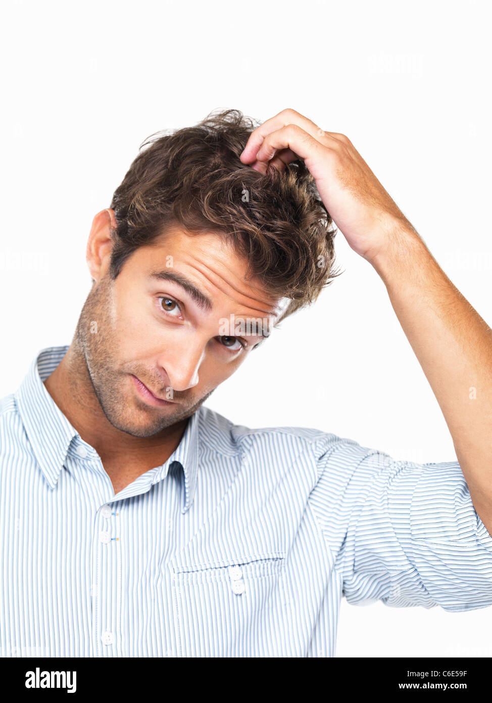 Portrait of handsome young executive scratching head Stock Photo - Alamy