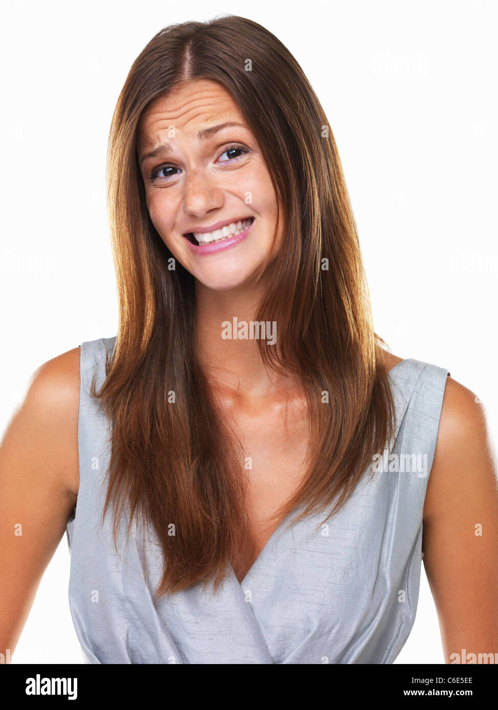 Studio portrait of woman with fake smile Stock Photo - Alamy