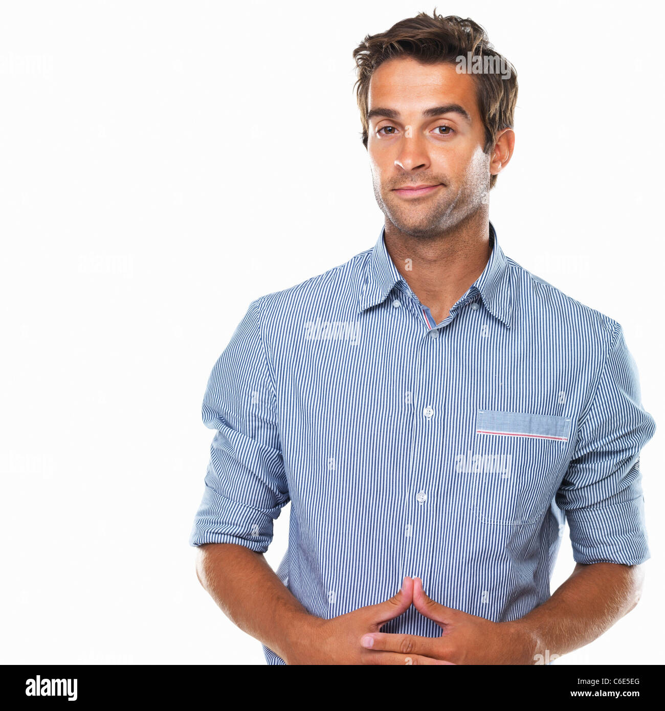 Studio portrait of business man smirking Stock Photo - Alamy