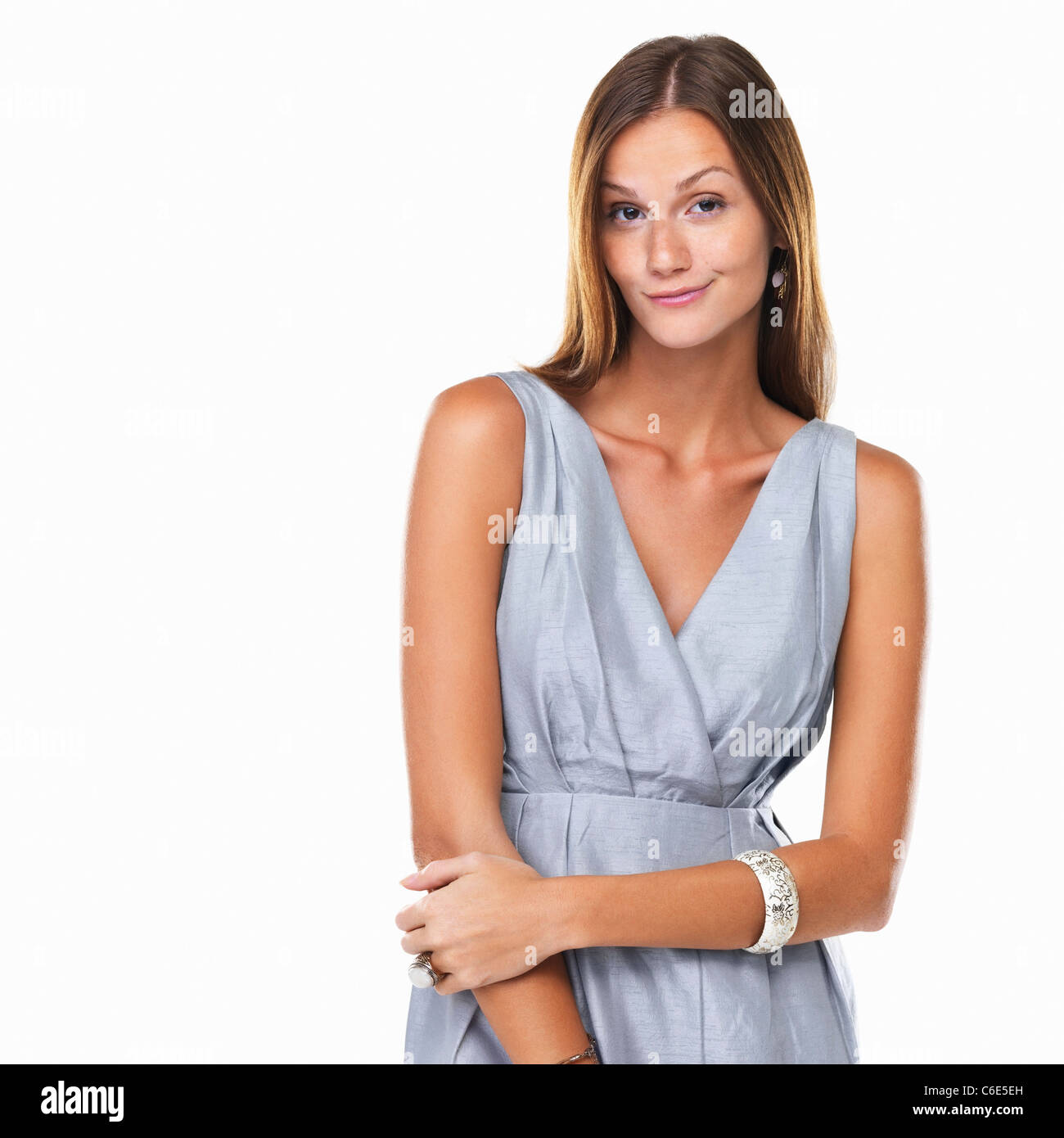 Studio portrait of elegant woman smirking Stock Photo - Alamy
