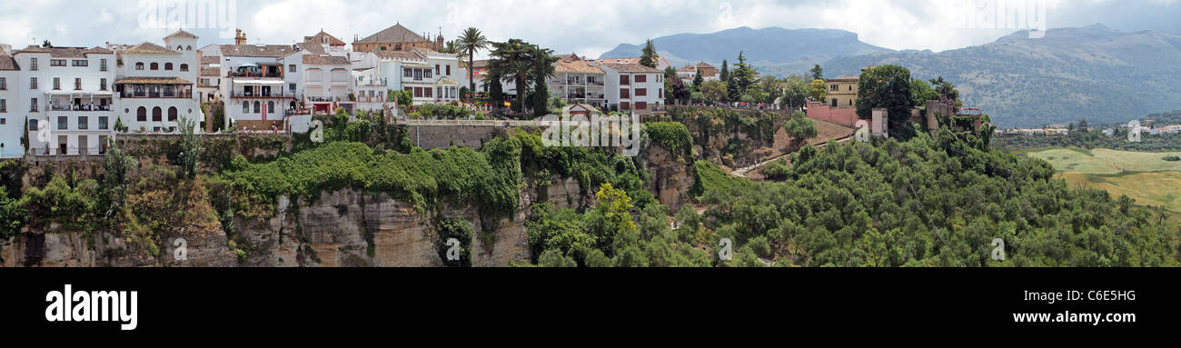 Bridge over deep gorge to Ronda Spain. Shows city with deep gorge ...