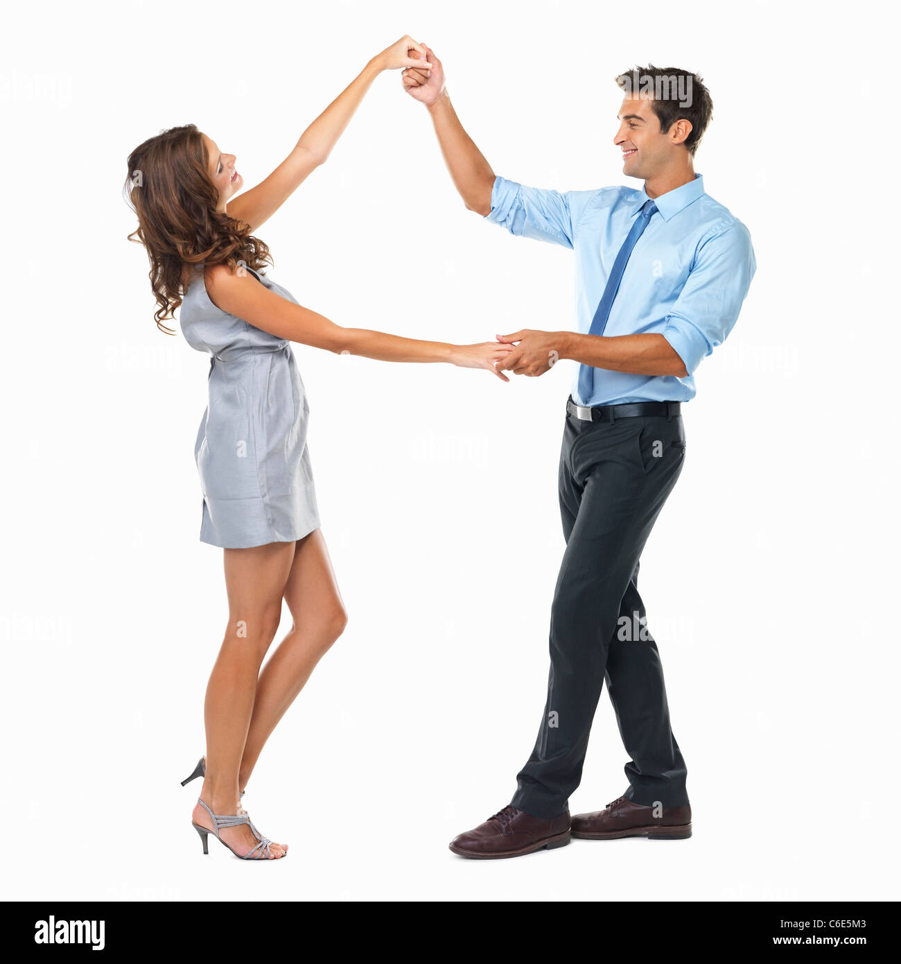Studio shot of happy couple dancing Stock Photo - Alamy