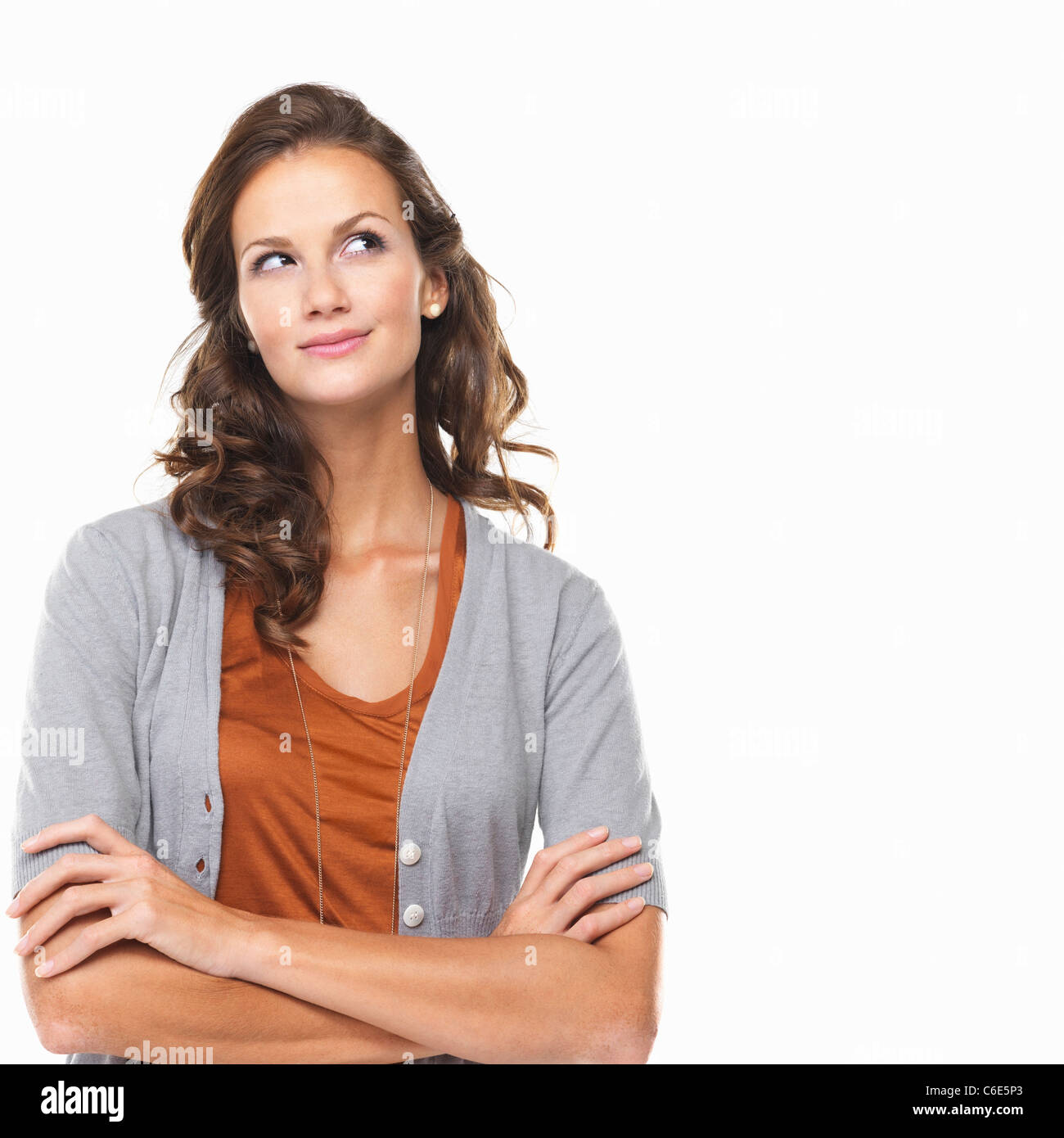 Studio portrait of woman thinking and looking up Stock Photo - Alamy
