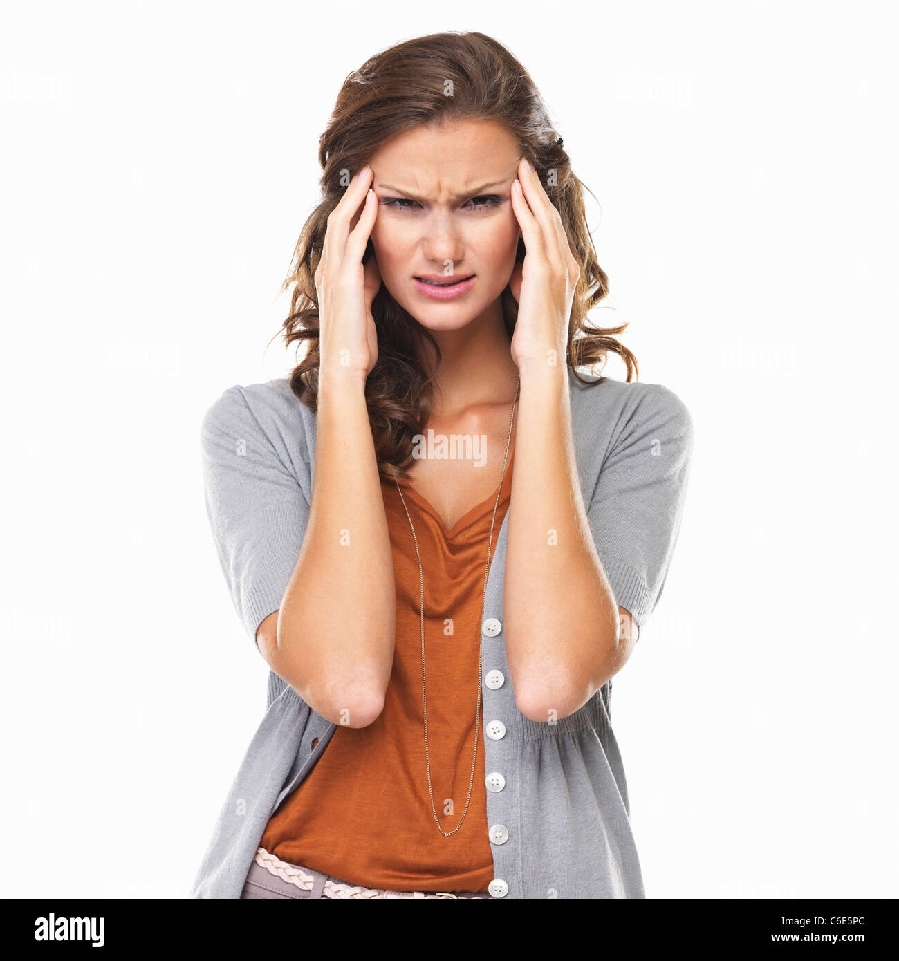Studio portrait of with head in hands Stock Photo - Alamy