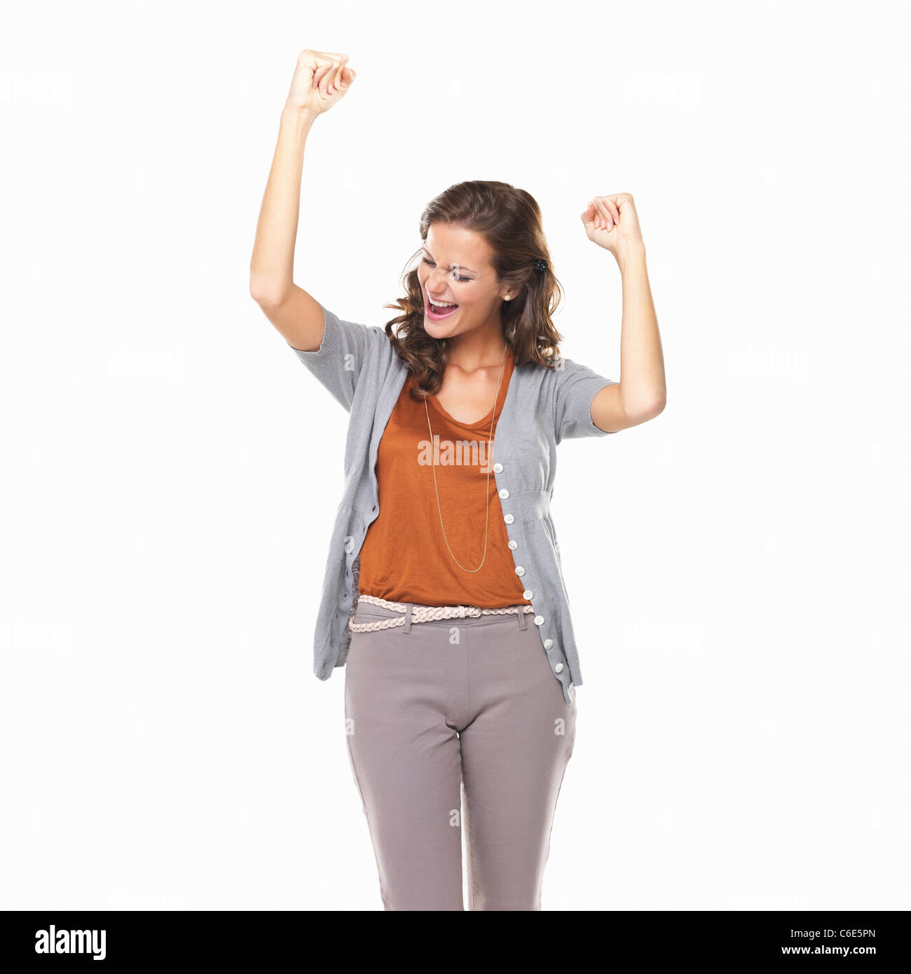 Studio portrait of excited young woman cheering Stock Photo - Alamy