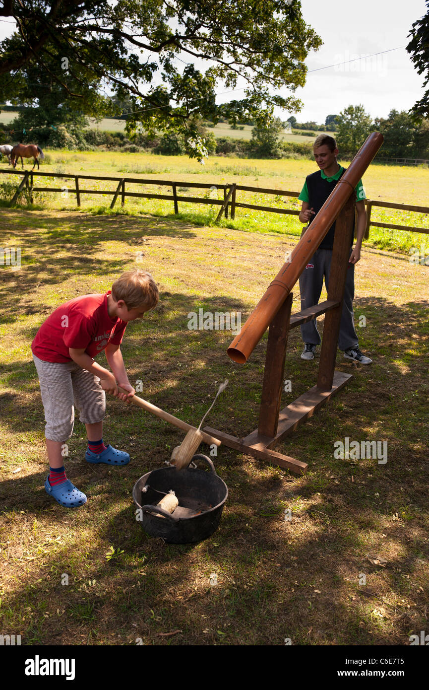 A seven year old boy plays smack the rat at a village fete in Weston ...