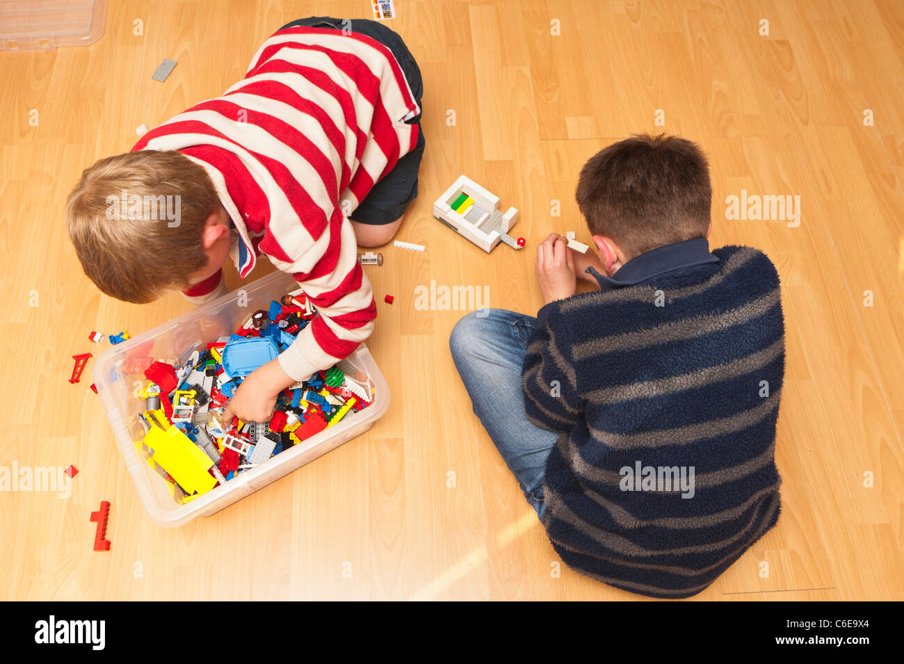 Two kids playing with lego hi-res stock photography and images - Alamy
