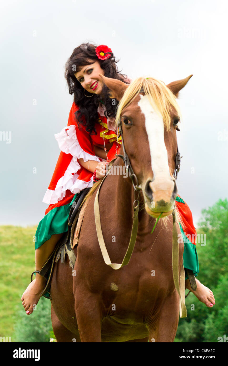 Beautiful gypsy girl riding horse hi-res stock photography and images ...