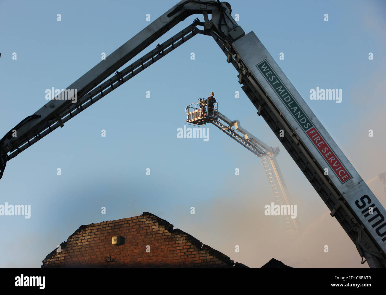 Fire Fighters working on the Factory Fire at Stuart Crystal Factory in ...