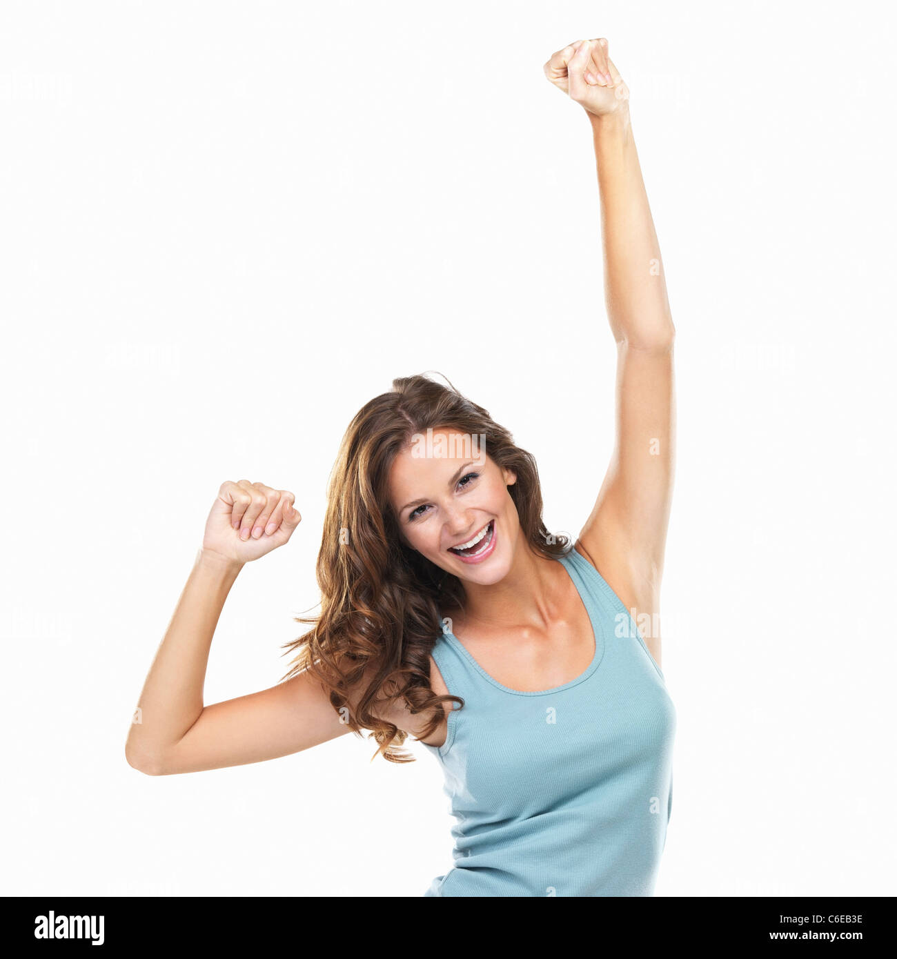 Studio portrait of beautiful woman with fists clenched in victory Stock ...