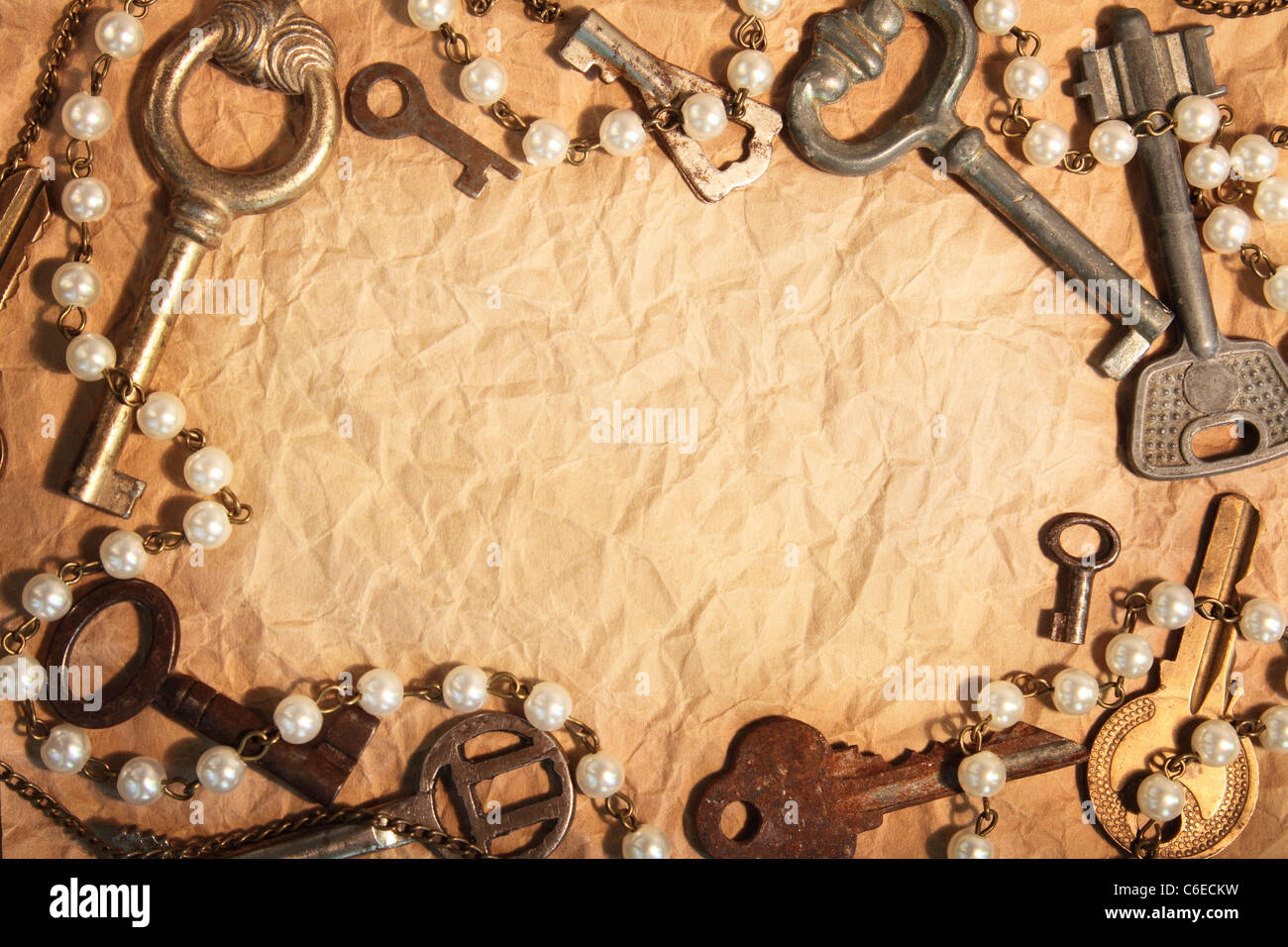 Blank sheet of crumpled paper, framed different old keys Stock Photo ...