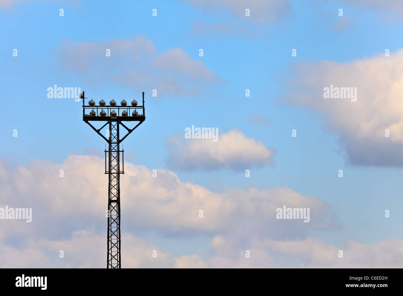 Tall tower with projectors for illumination of stadium Stock Photo - Alamy