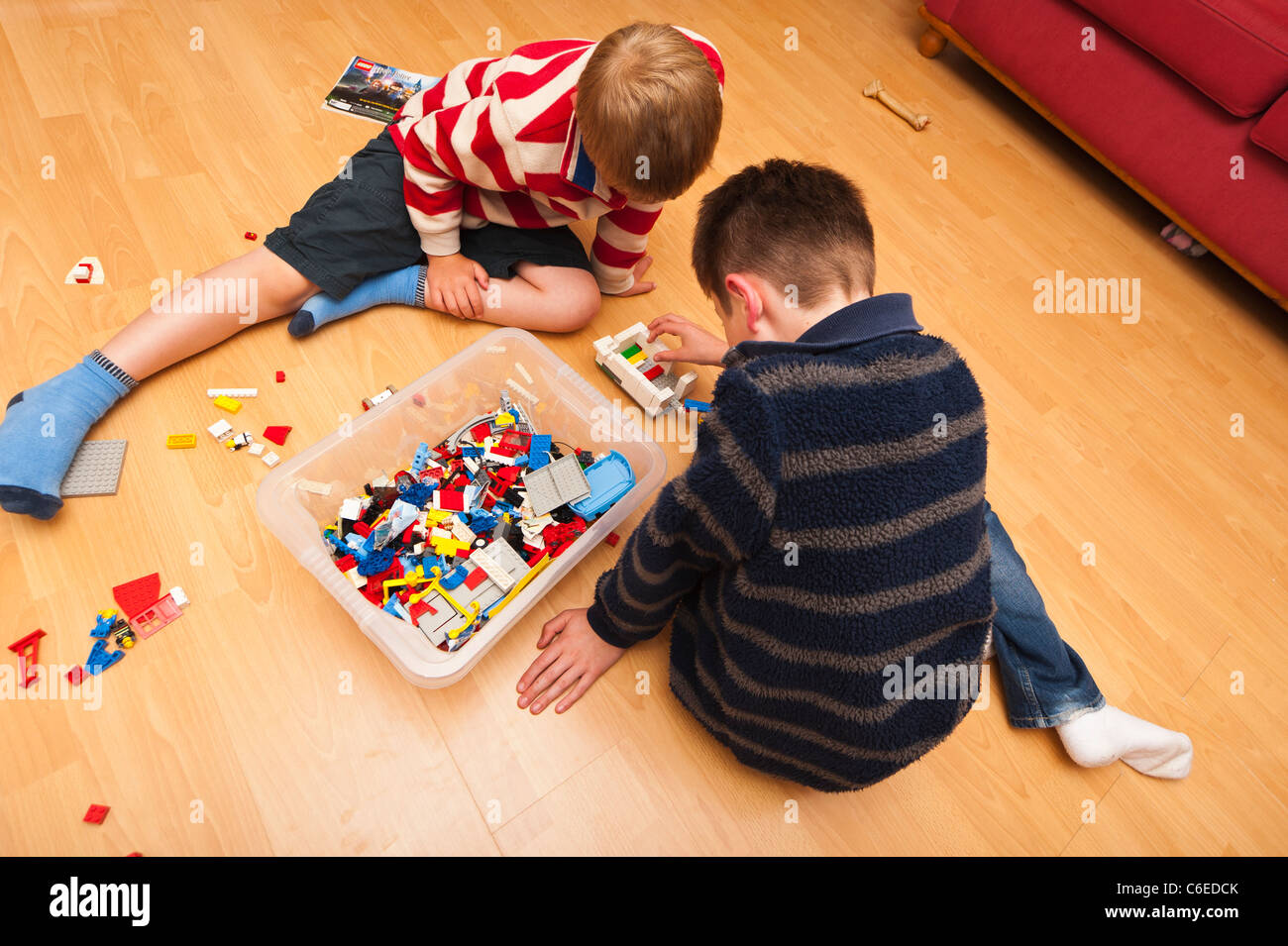 Two boys playing Lego indoors in the Uk Stock Photo - Alamy