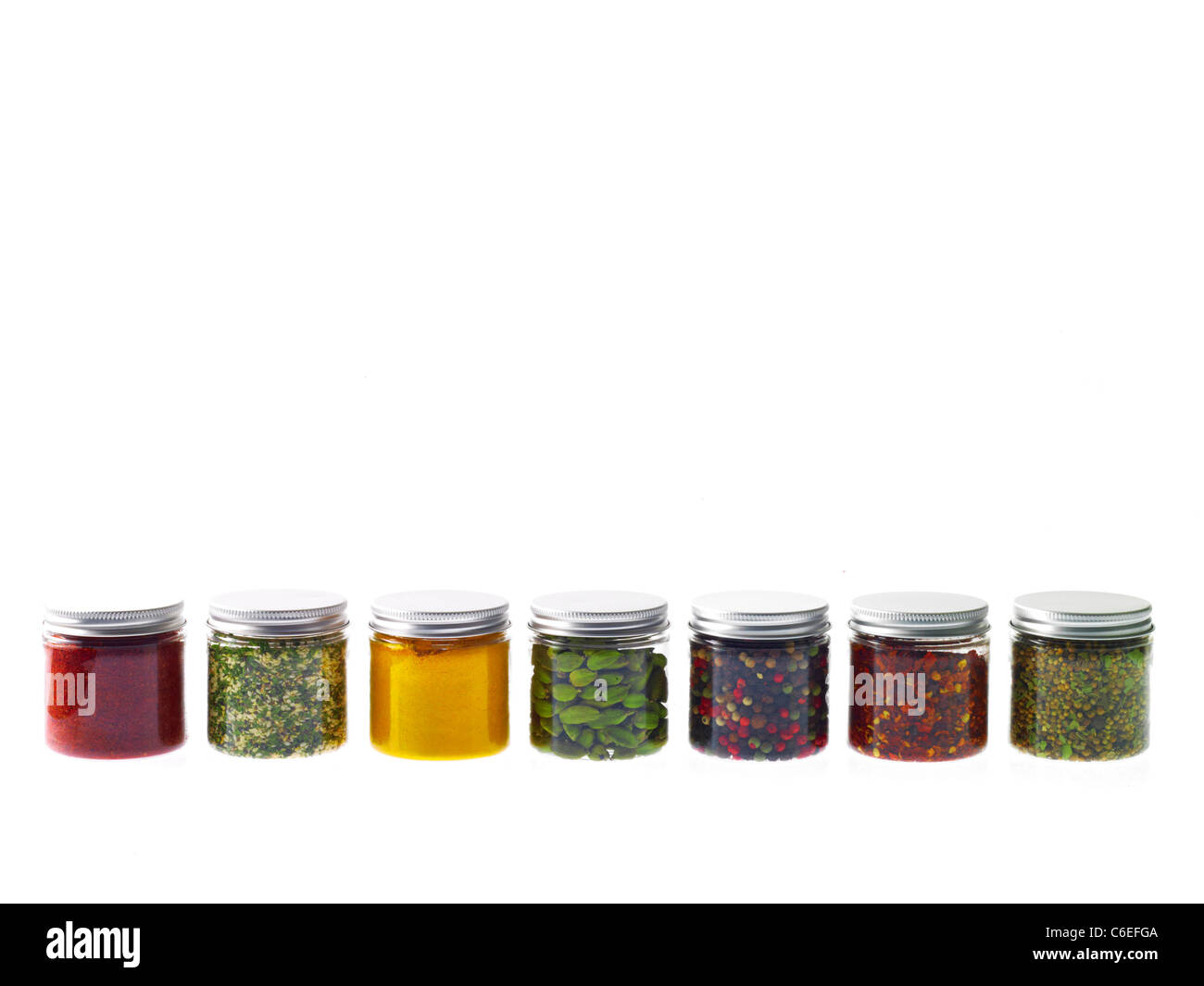 Studio shot of row of jars with spices Stock Photo - Alamy