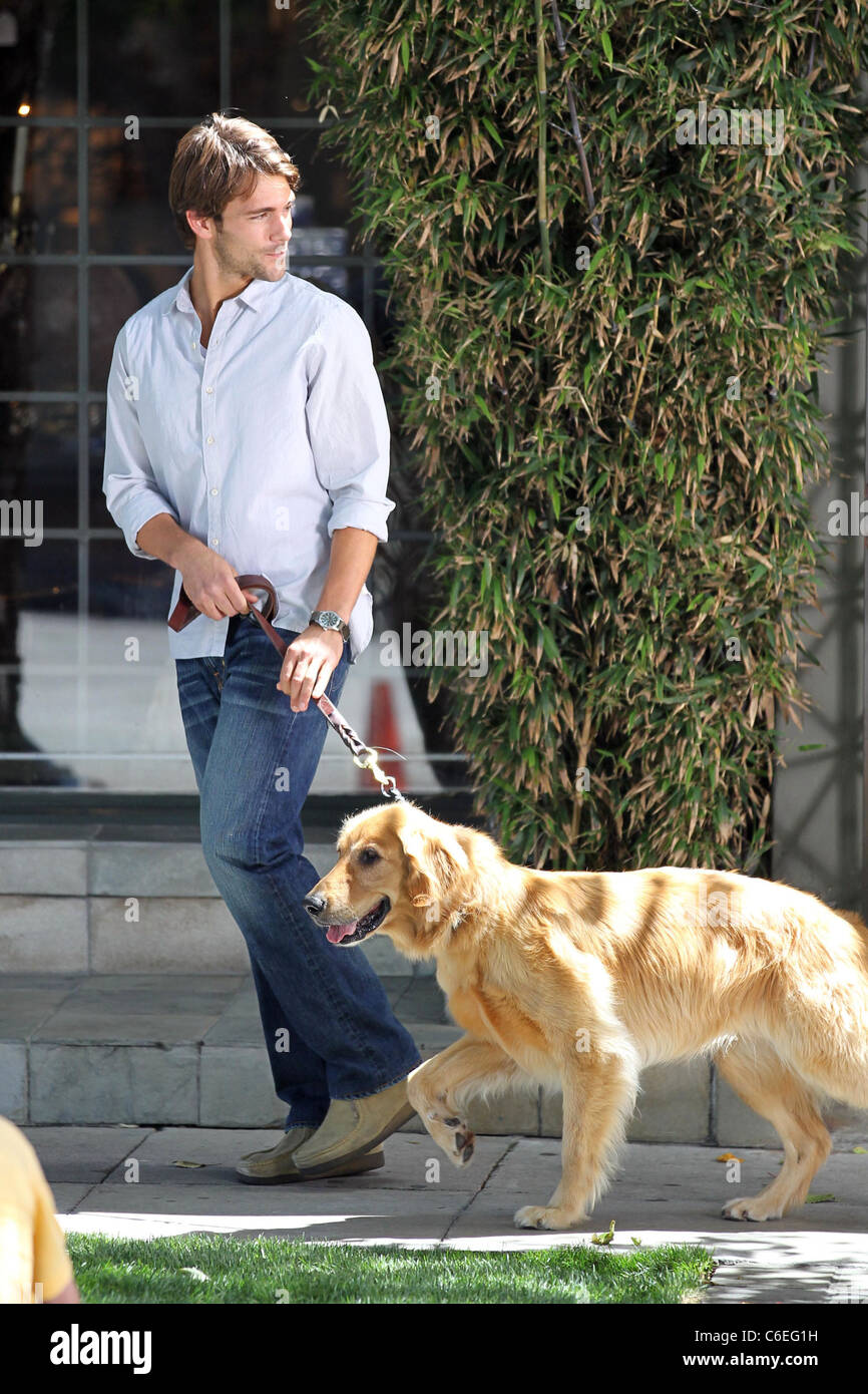 An actor walks a dog on a film set in West Hollywood. Los Angeles ...