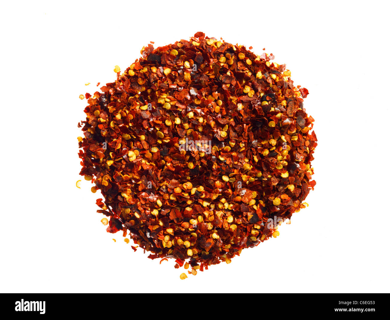Studio shot of Hot Pepper Flakes on white background Stock Photo - Alamy