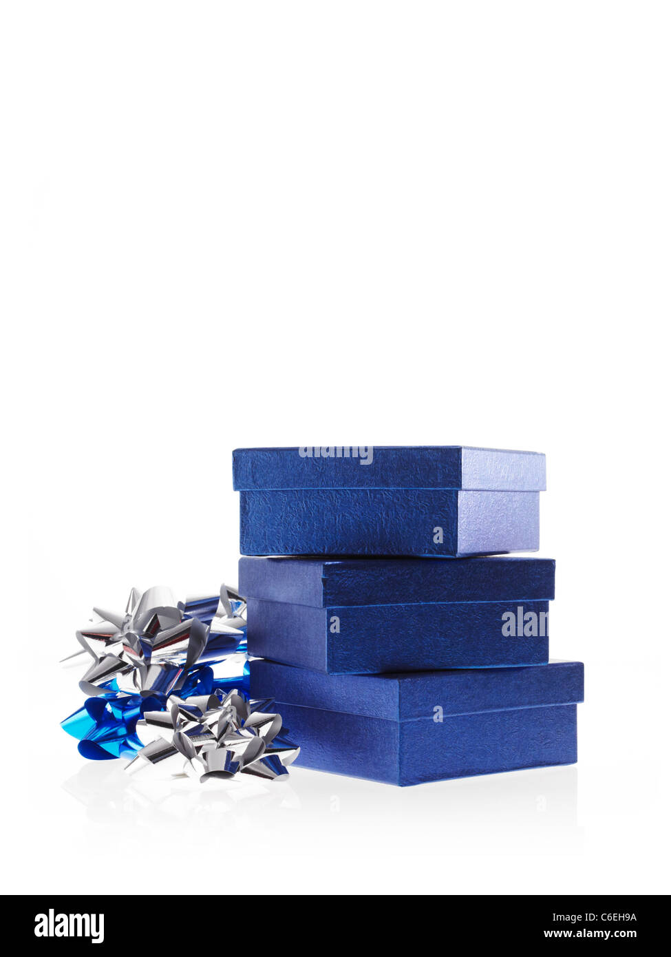 Stack of blue boxes with ribbons, studio shot Stock Photo - Alamy