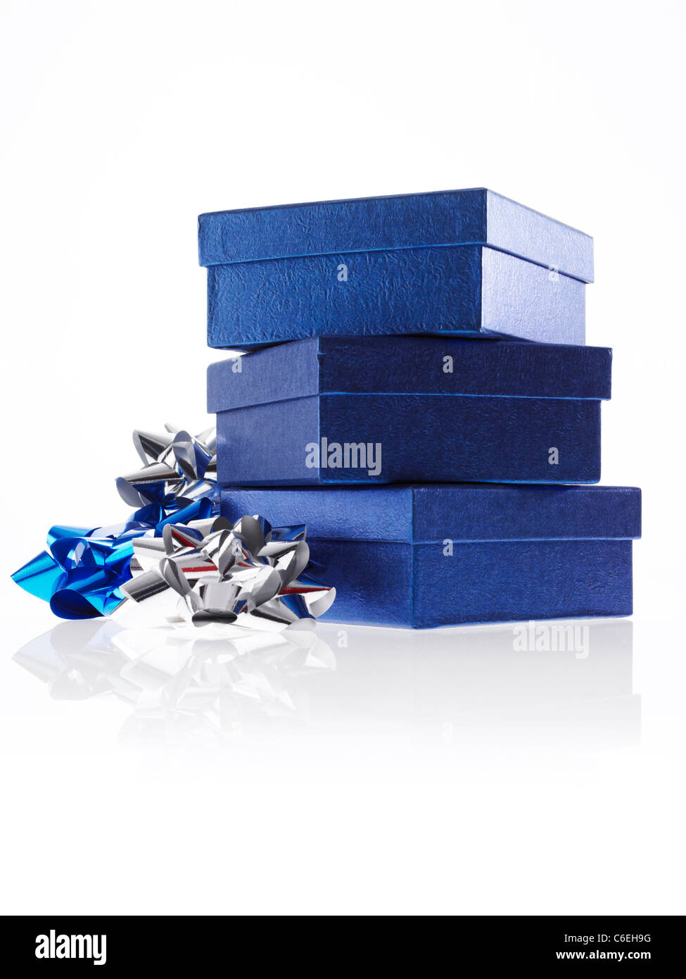 Stack of blue boxes with ribbons, studio shot Stock Photo - Alamy