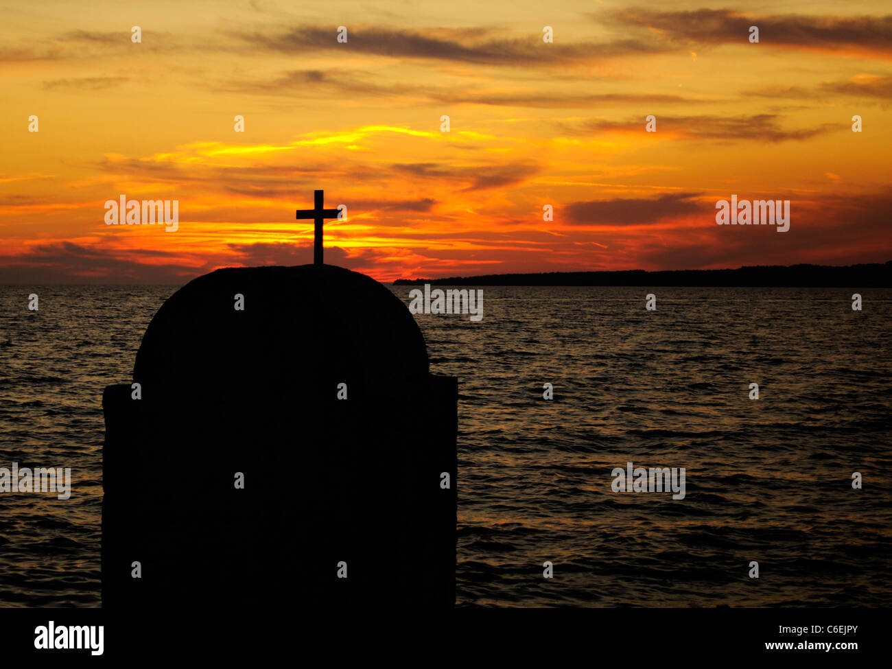 Catholic cross and sunset Stock Photo - Alamy