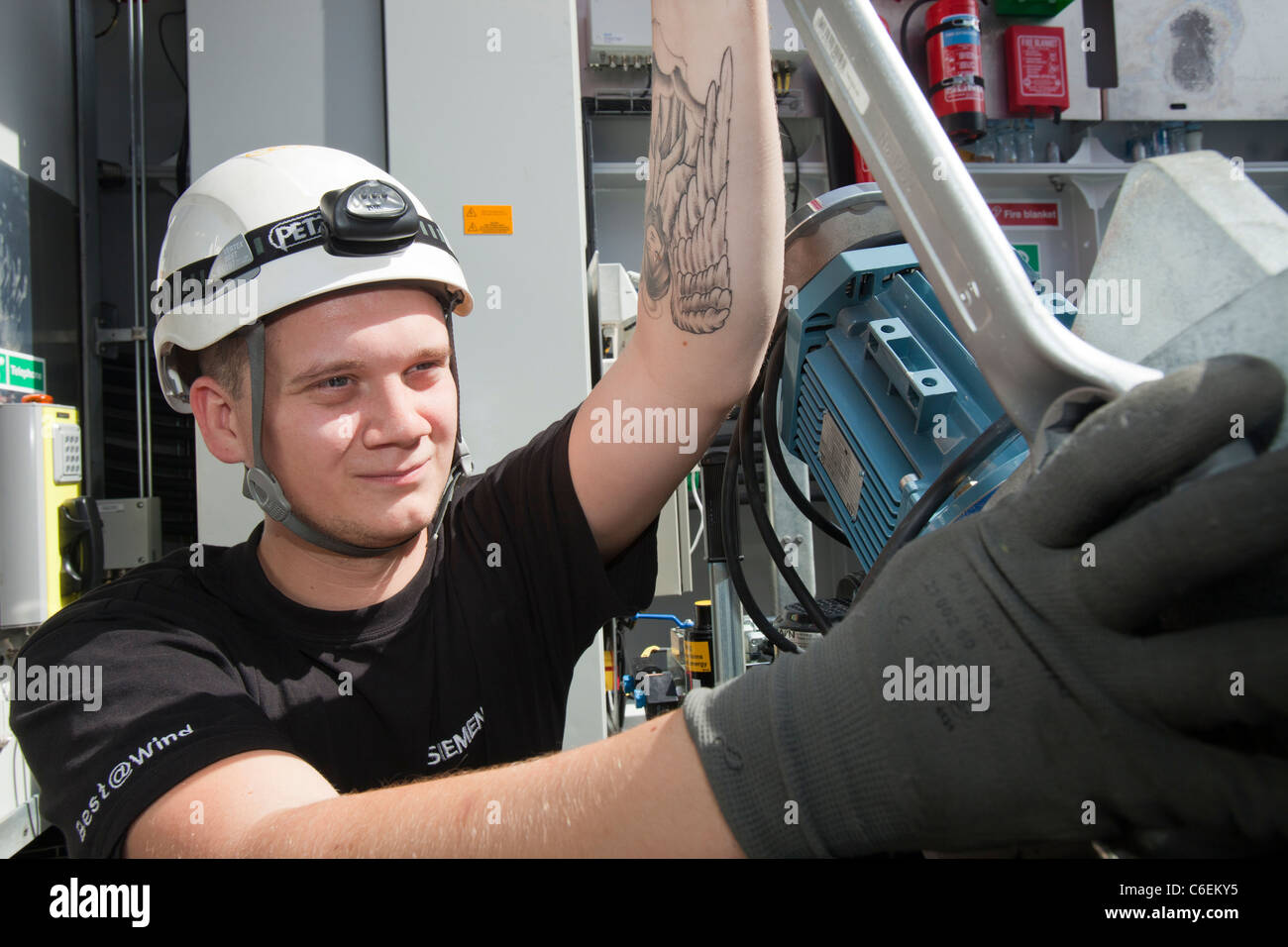A worker commissioning a wind turbine on the Walney offshore wind farm ...