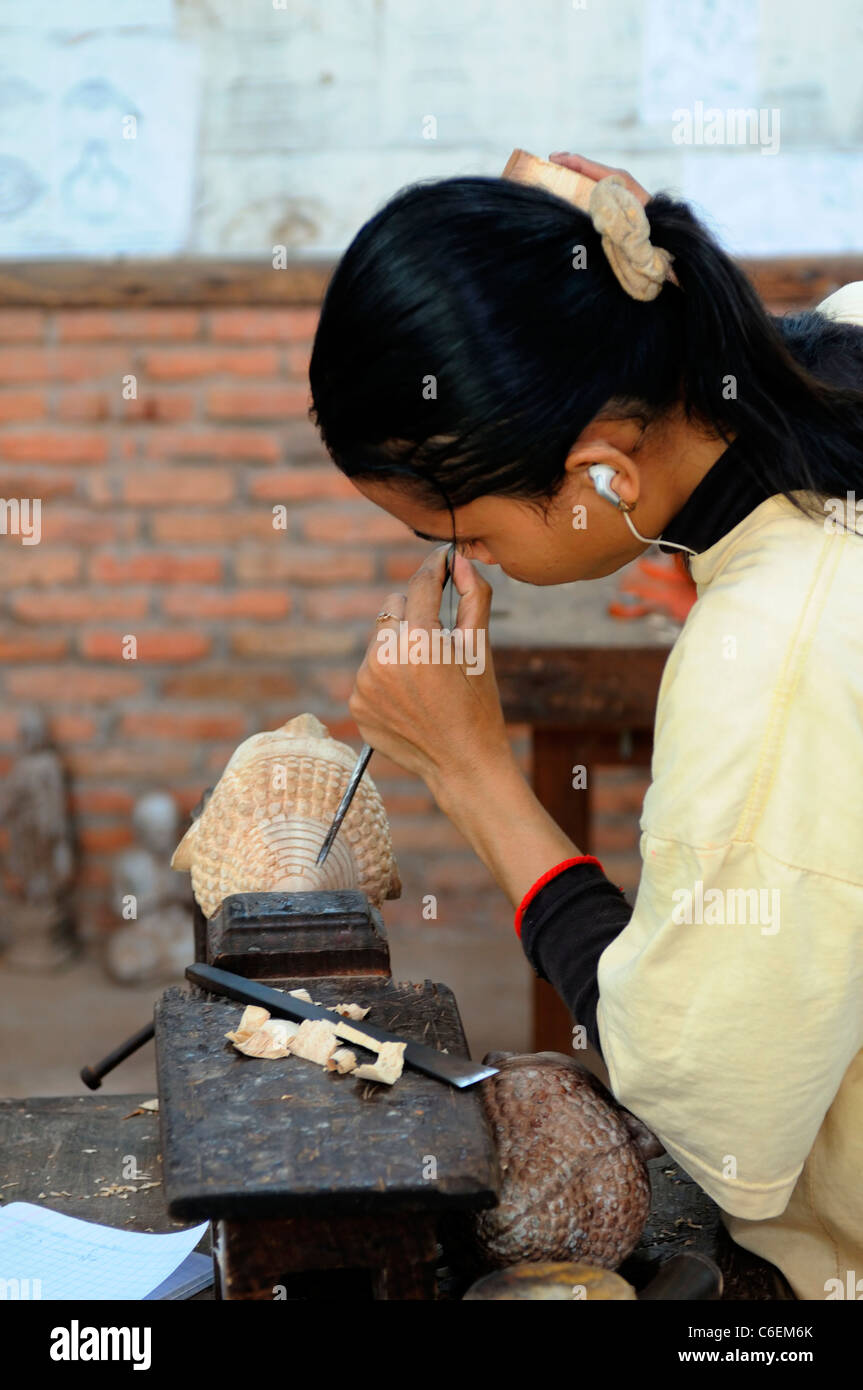 woman carving carve make making stone head workshop siem reap cambodia ...