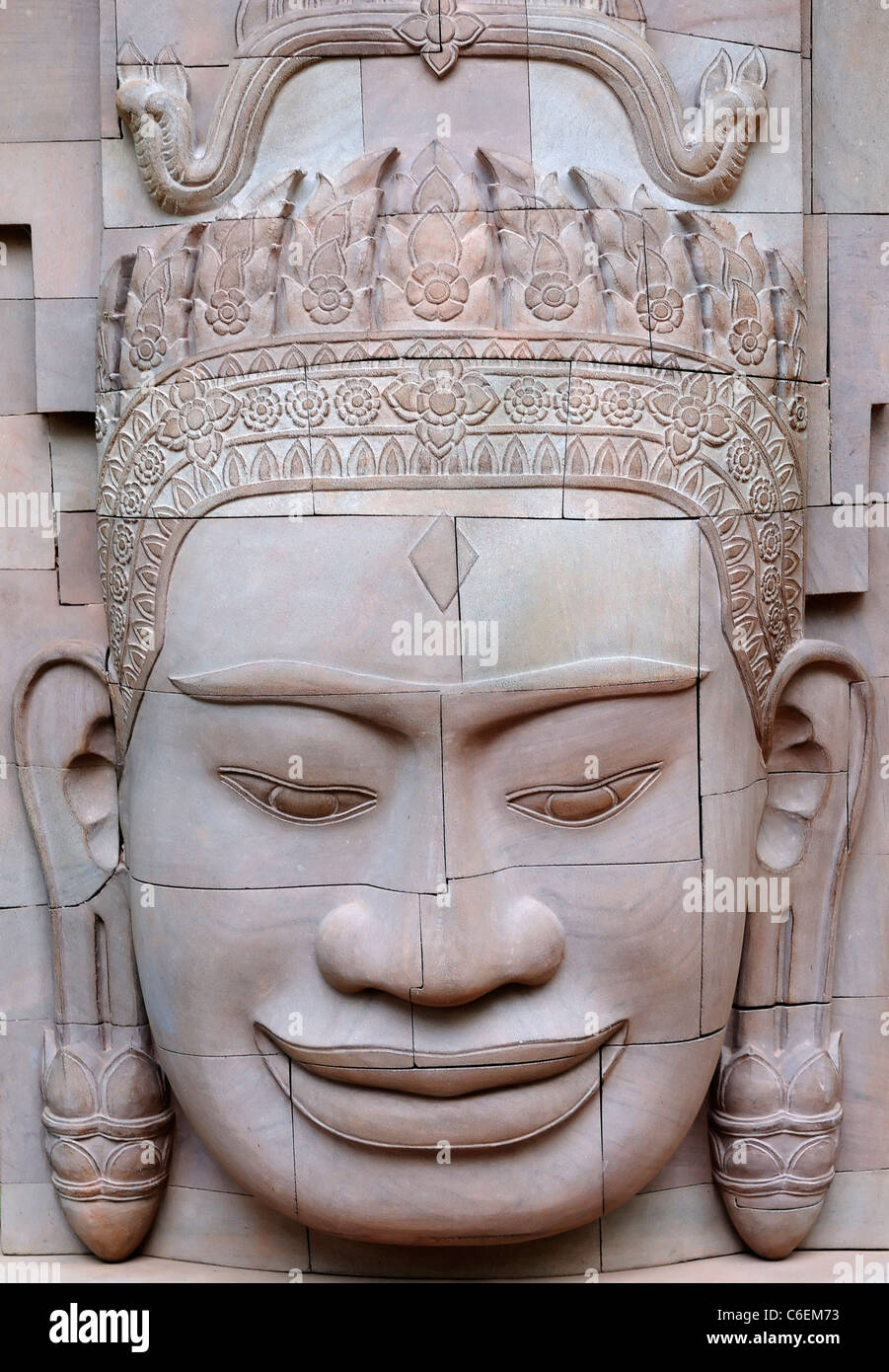 carved carving sandstone reproduction of angkor thom bayon head face ...