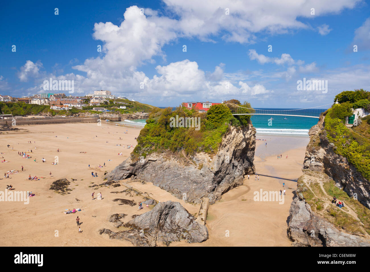 holidaymakers and surfers on the beach at Newquay, Cornwall, England ...