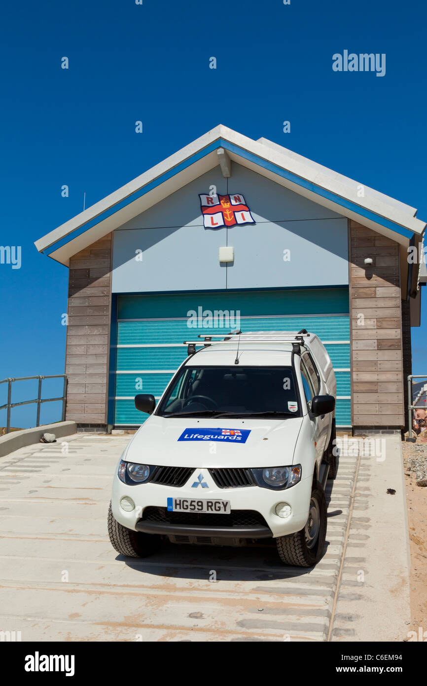 RNLI lifeguard rescue vehicle at the beach in Newquay Cornwall England ...