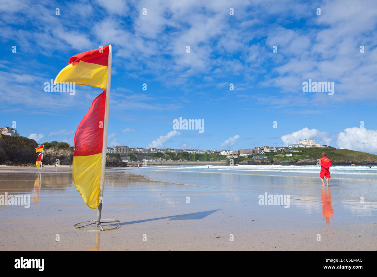 Lifeguard on duty warning flags yellow and red on newquay beaches ...