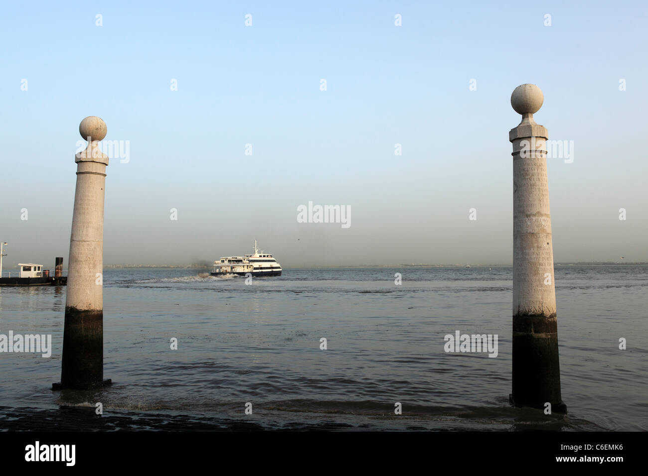 A ferry departs from the Terreiro do Paco terminal past inscribed ...