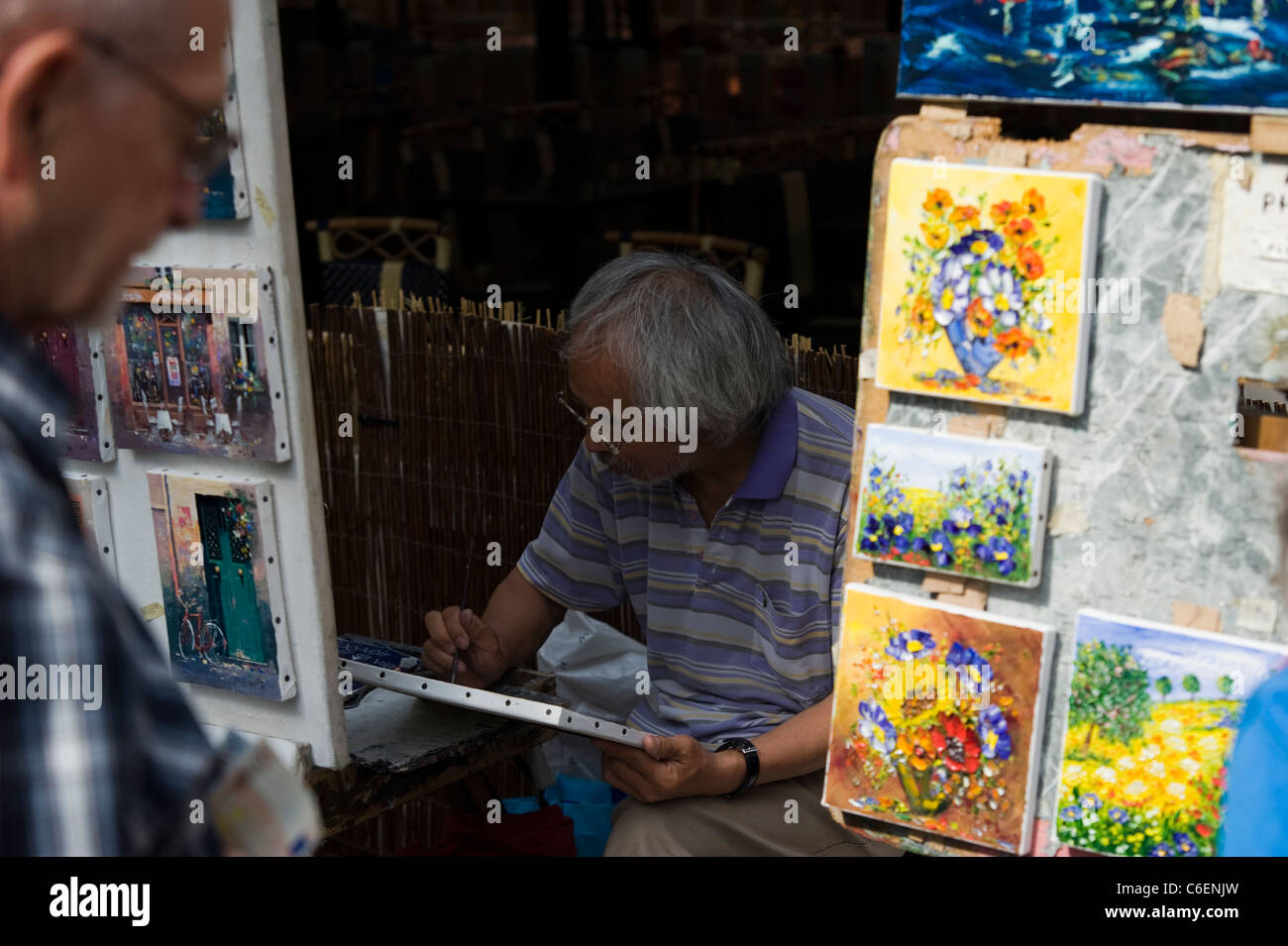 A painter at work in main place of Montparnasse - PARIS Stock Photo - Alamy