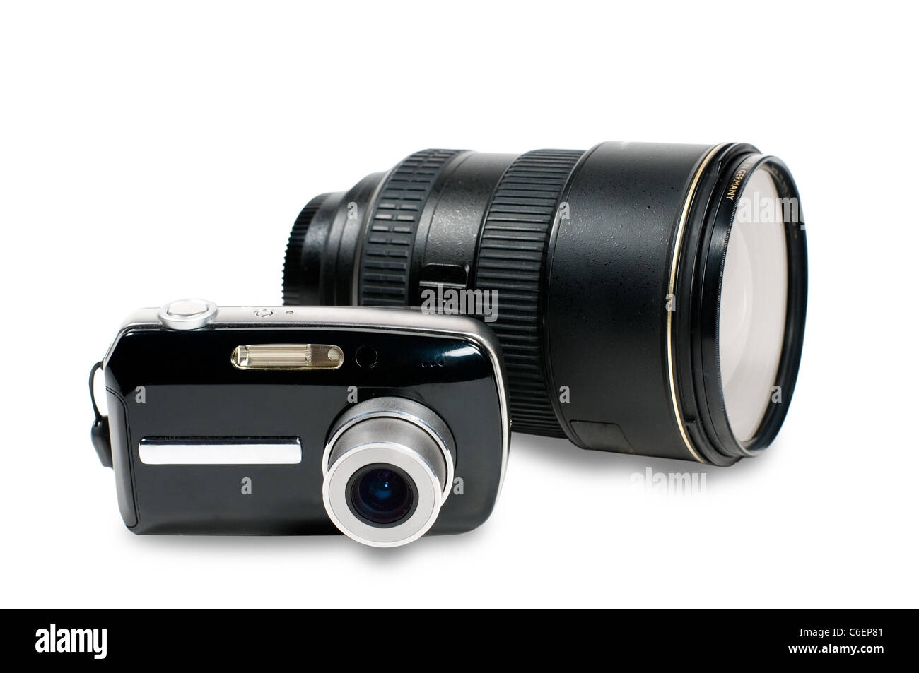 The small camera and the big lens it is isolated on a white background ...