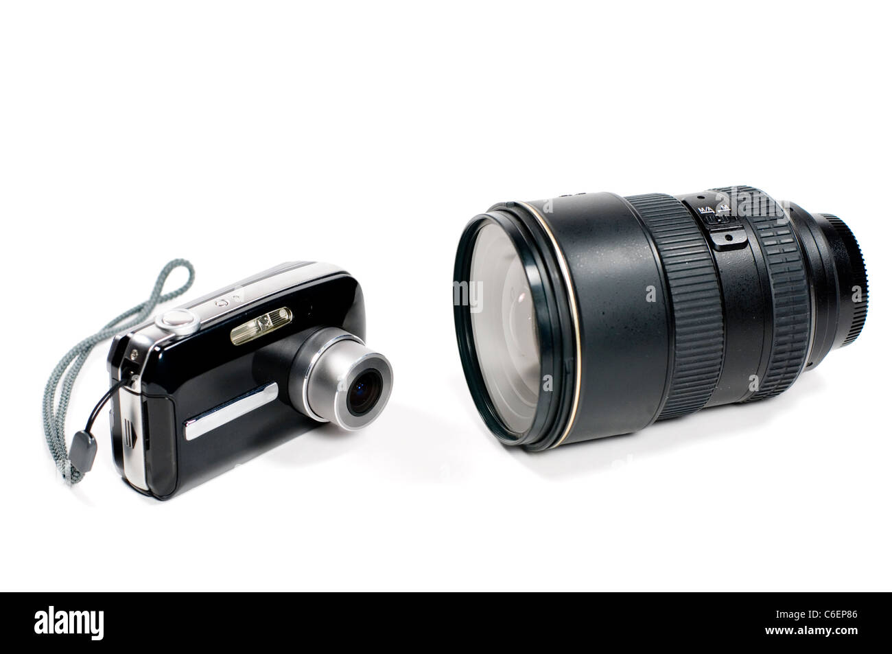 The small camera and the big lens it is isolated on a white background ...
