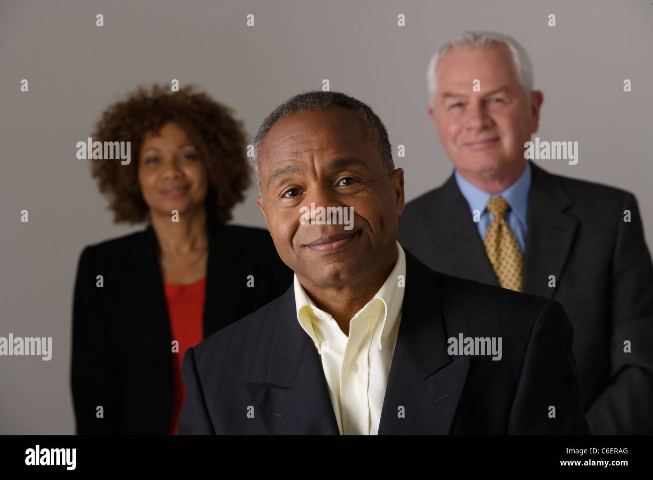 Portrait of three business people, studio shot Stock Photo - Alamy