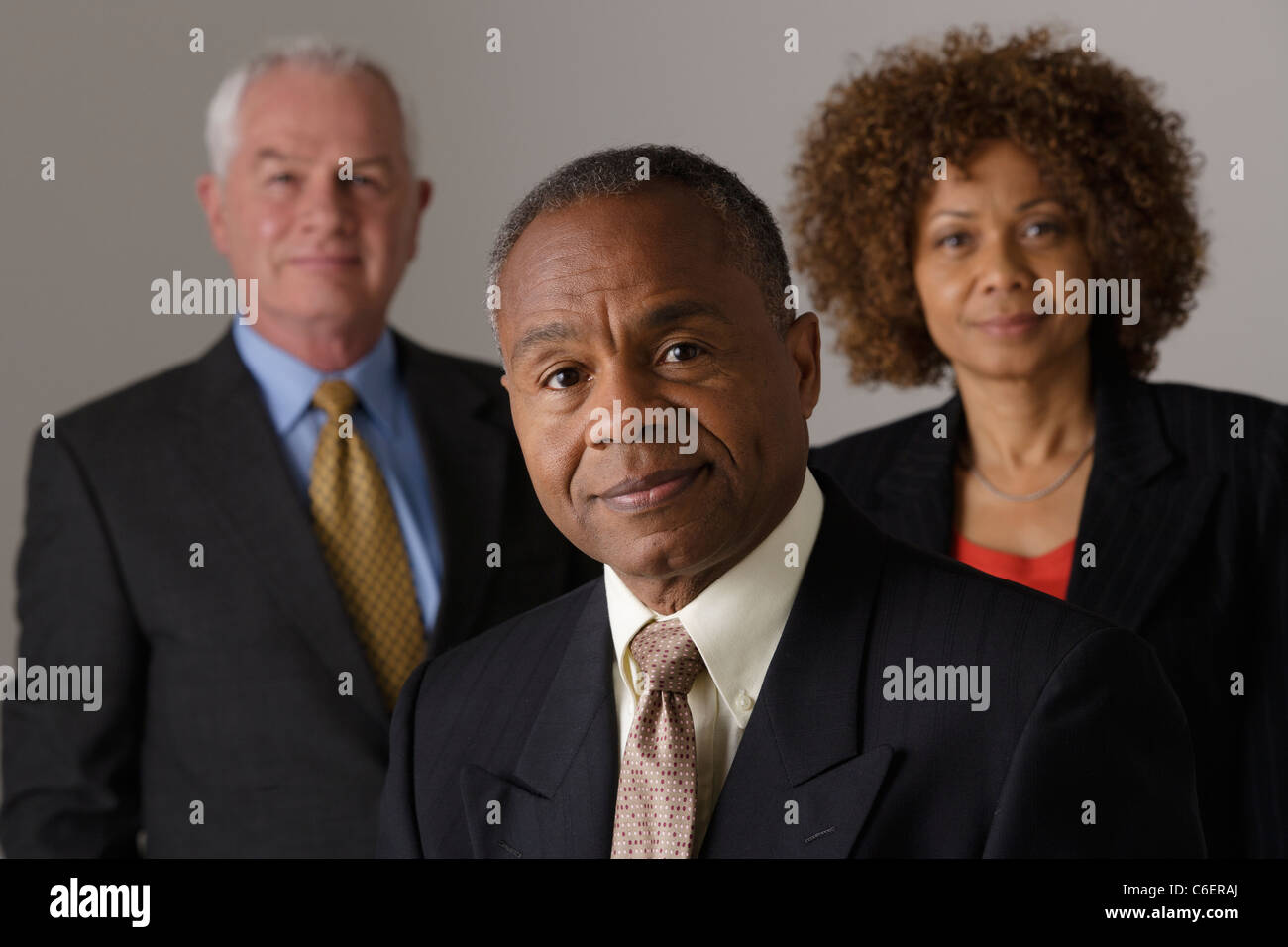 Portrait of three business people, studio shot Stock Photo - Alamy