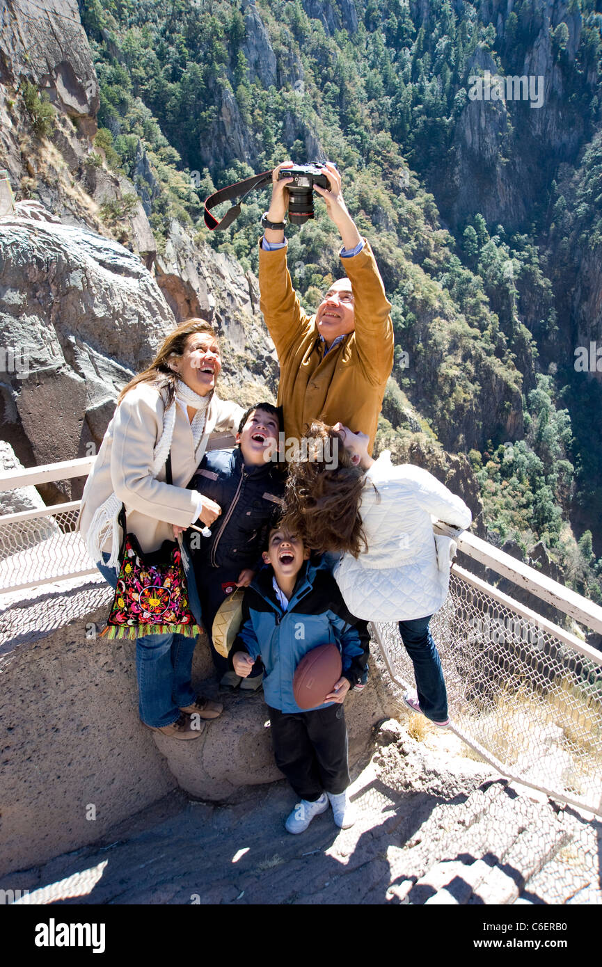 President Felipe Calderon of Mexico takes a photo of his family at the ...