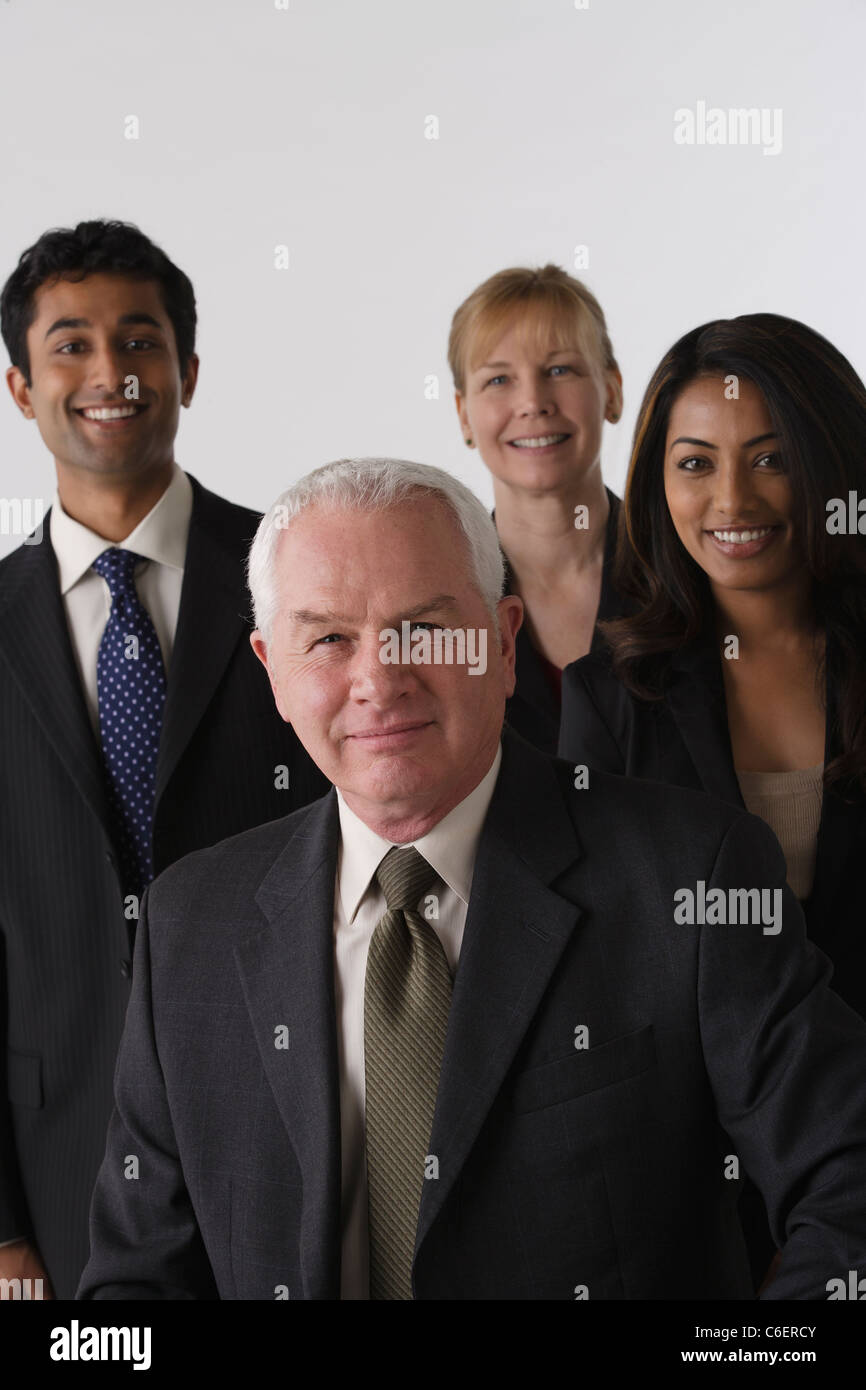 Portrait of four business people, studio shot Stock Photo - Alamy